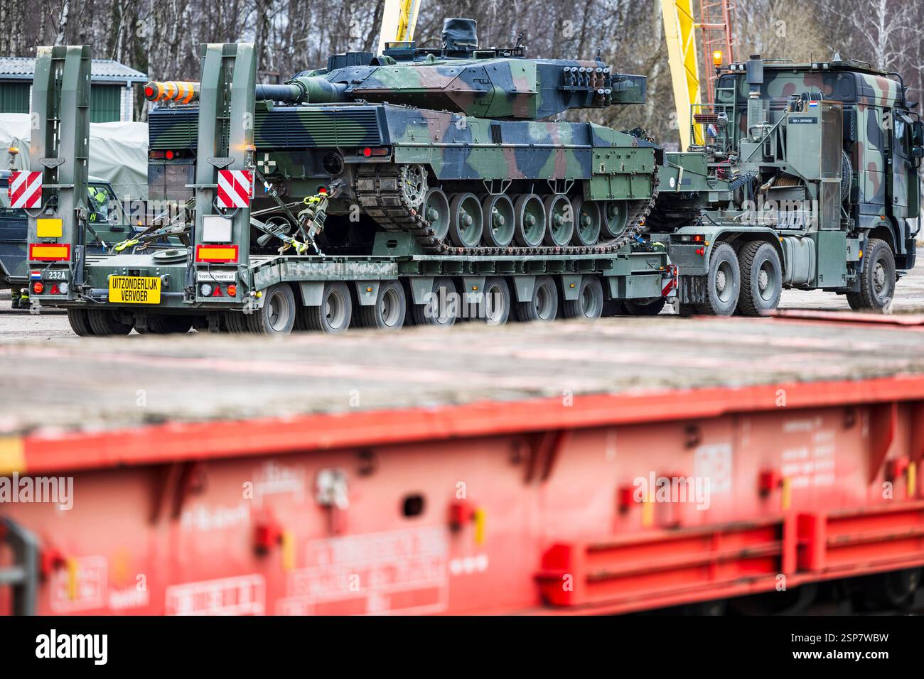 A German Leopard 2A7 main battle tank loaded onto a heavy-duty military ...