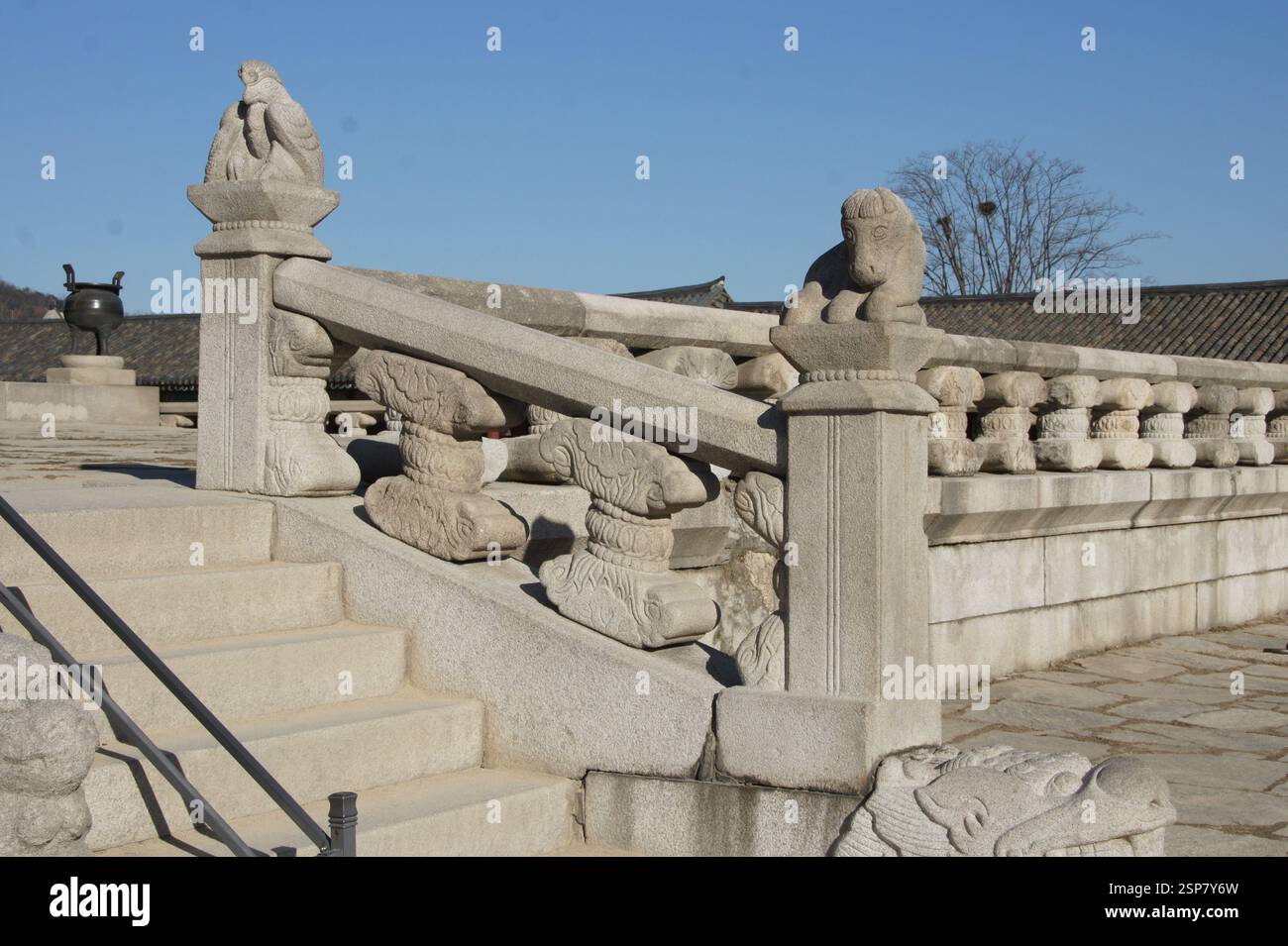 Stone balustrade with animal sculptures. Carved stone with intricate ...
