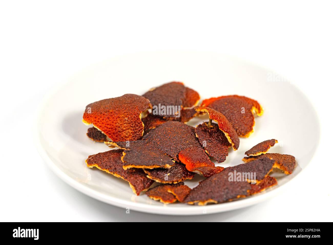 Dried tangerine peel on a plate Stock Photo - Alamy