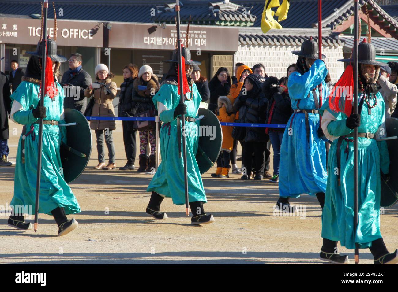 Gyeongbokgung Palace guard in traditional uniform standing on a stone ...