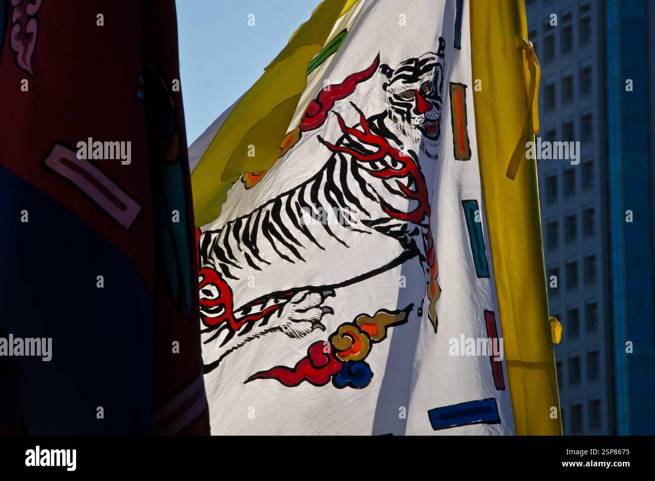 Flag with white tiger. Bold black stripes against yellow background ...