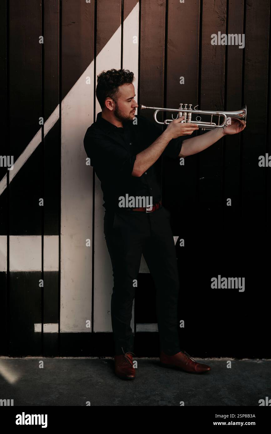 Moody portrait of a stylish trumpet player Stock Photo - Alamy