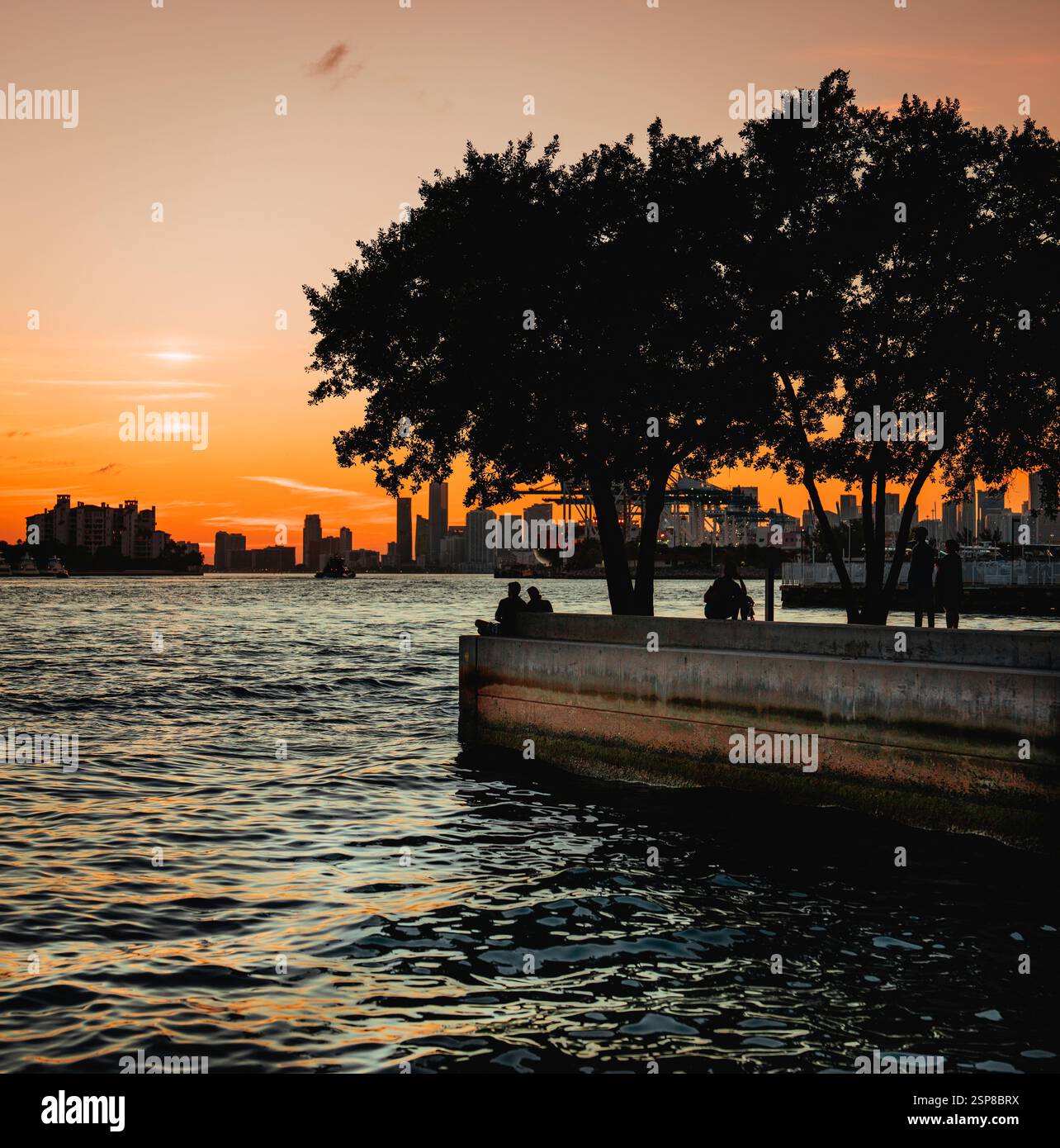 beautiful scene sunset on the beach sea couple romantic Stock Photo - Alamy