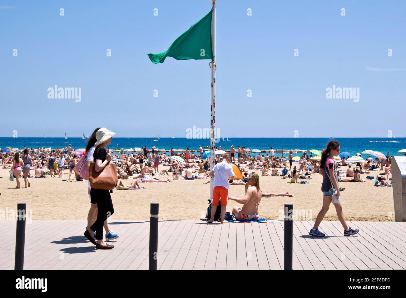 Green flag on the beach, Beautiful late spring day in Barceloneta beach ...