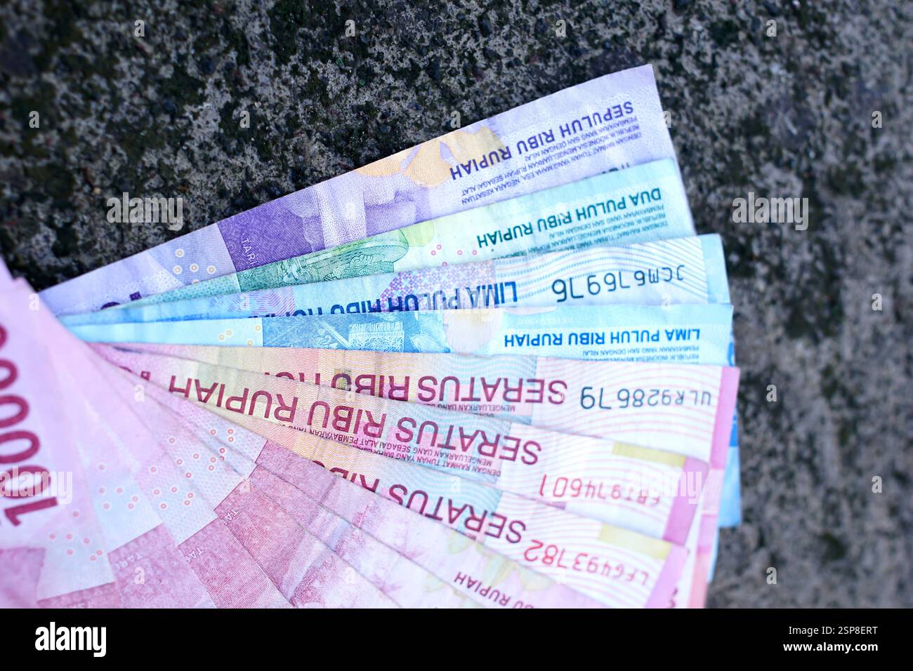Indonesian money is neatly lined up with various denominations Stock ...