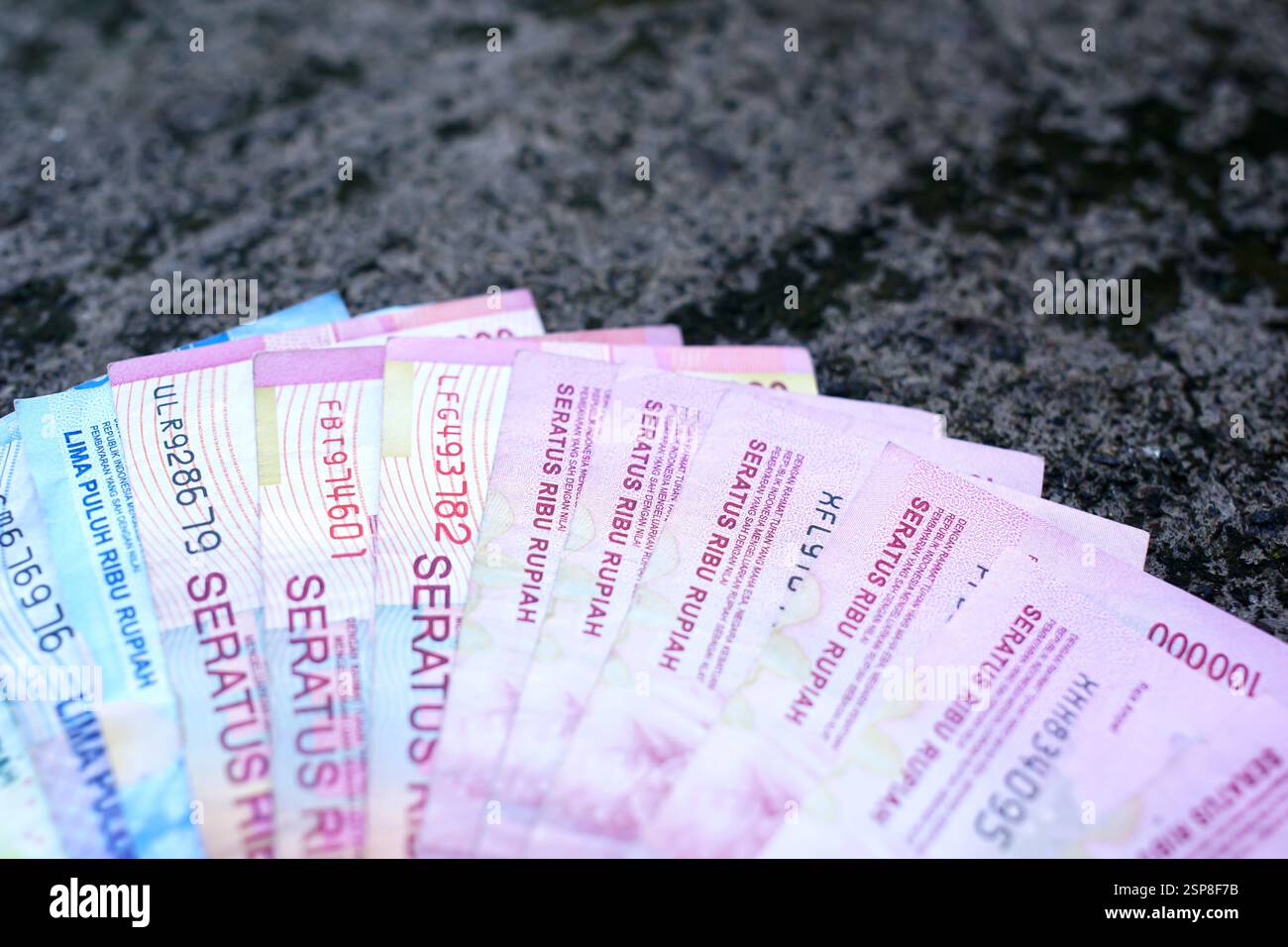 Indonesian money is neatly lined up with various denominations Stock ...