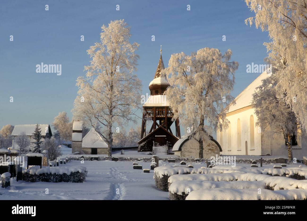 Oviken Old Church after snowfall during a midwinter day. Bright ...