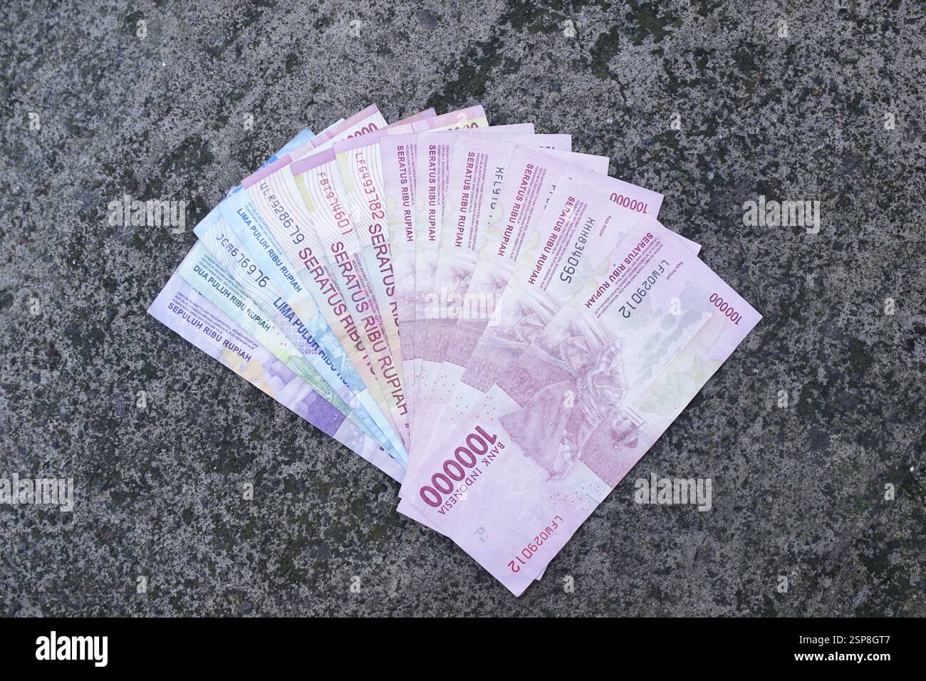 Indonesian money is neatly lined up with various denominations Stock ...