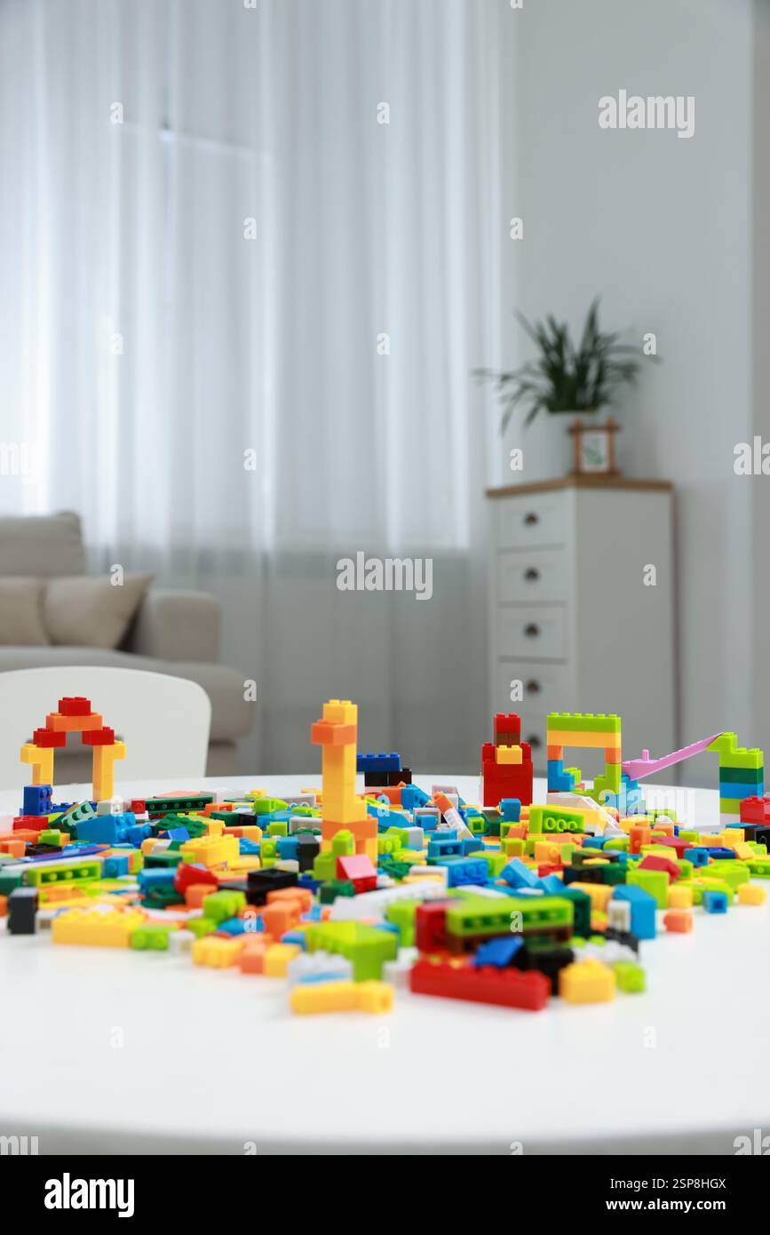 Construction toy. Figures made with building bricks and colorful blocks ...