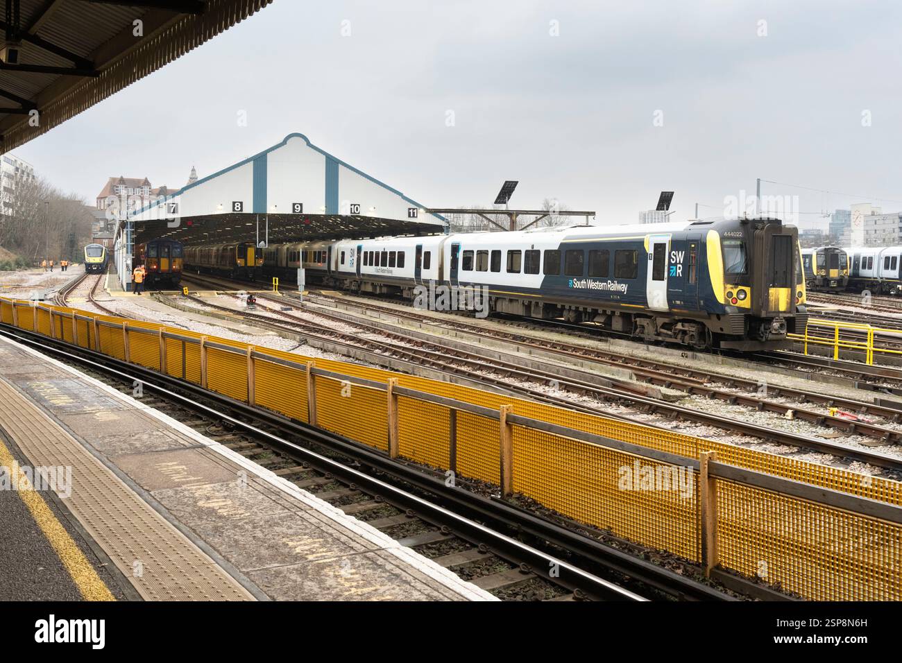 South Western Railway trains at Clapham Junction station, London ...
