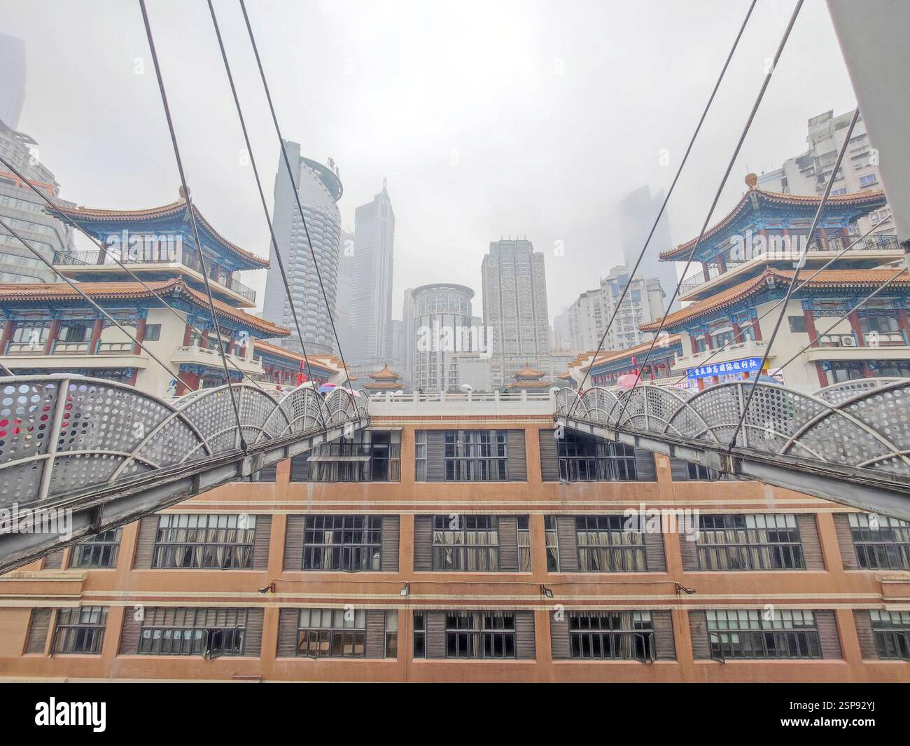 CHONGQING, CHINA - FEBRUARY 14, 2025 - Tourists overlook the city view ...