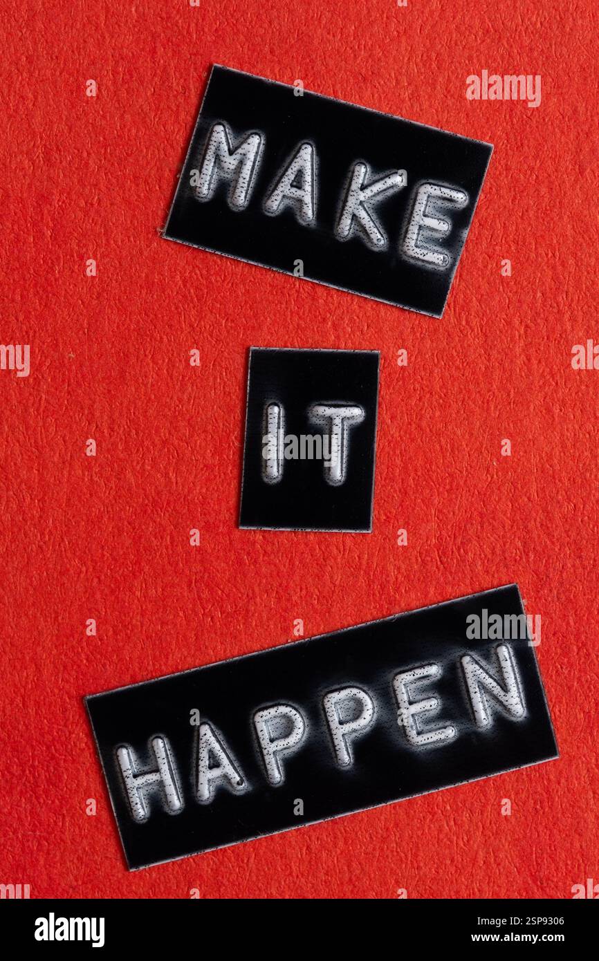 Make it happen words written with black marker on red paper background ...