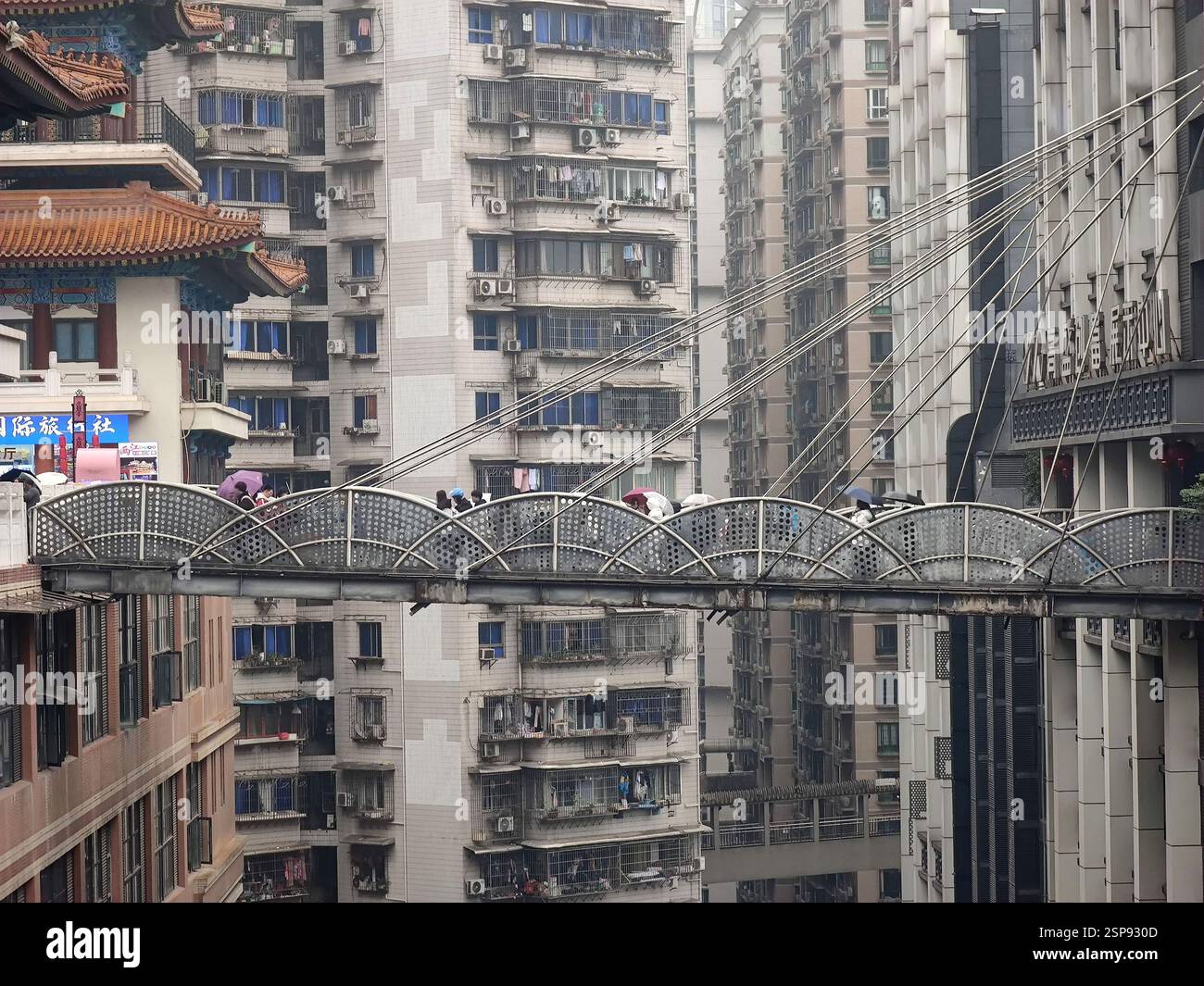 CHONGQING, CHINA - FEBRUARY 14, 2025 - Tourists overlook the city view ...