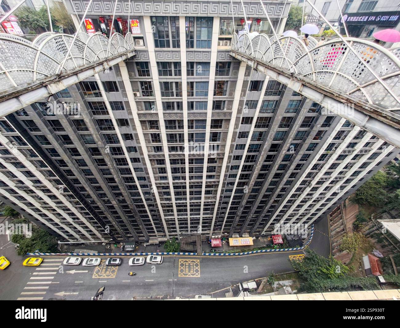 CHONGQING, CHINA - FEBRUARY 14, 2025 - Tourists overlook the city view ...