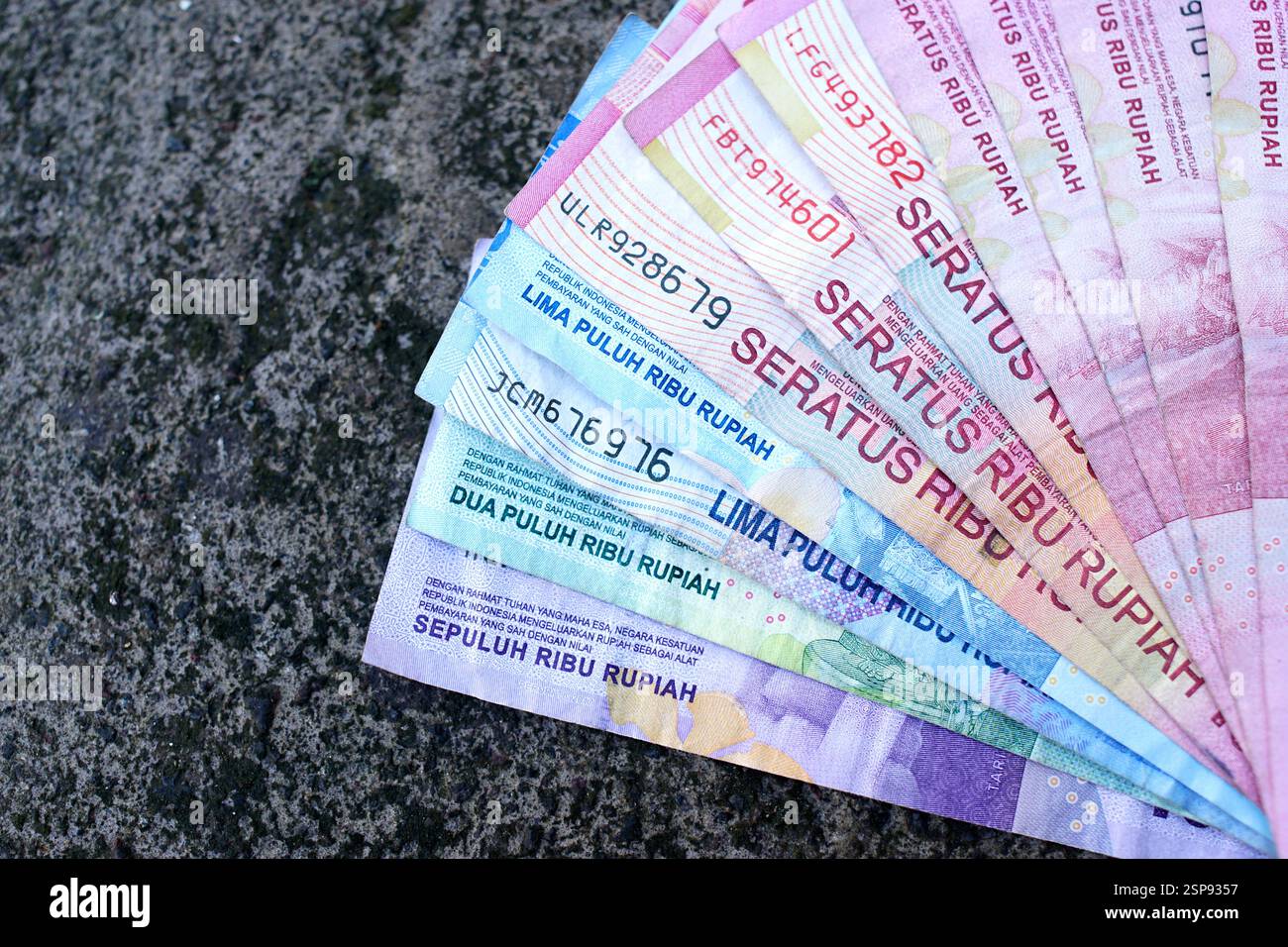 Indonesian money is neatly lined up with various denominations Stock ...
