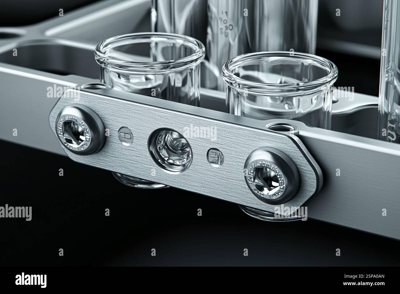 Clear glass containers are positioned in a metal frame, ready for use ...