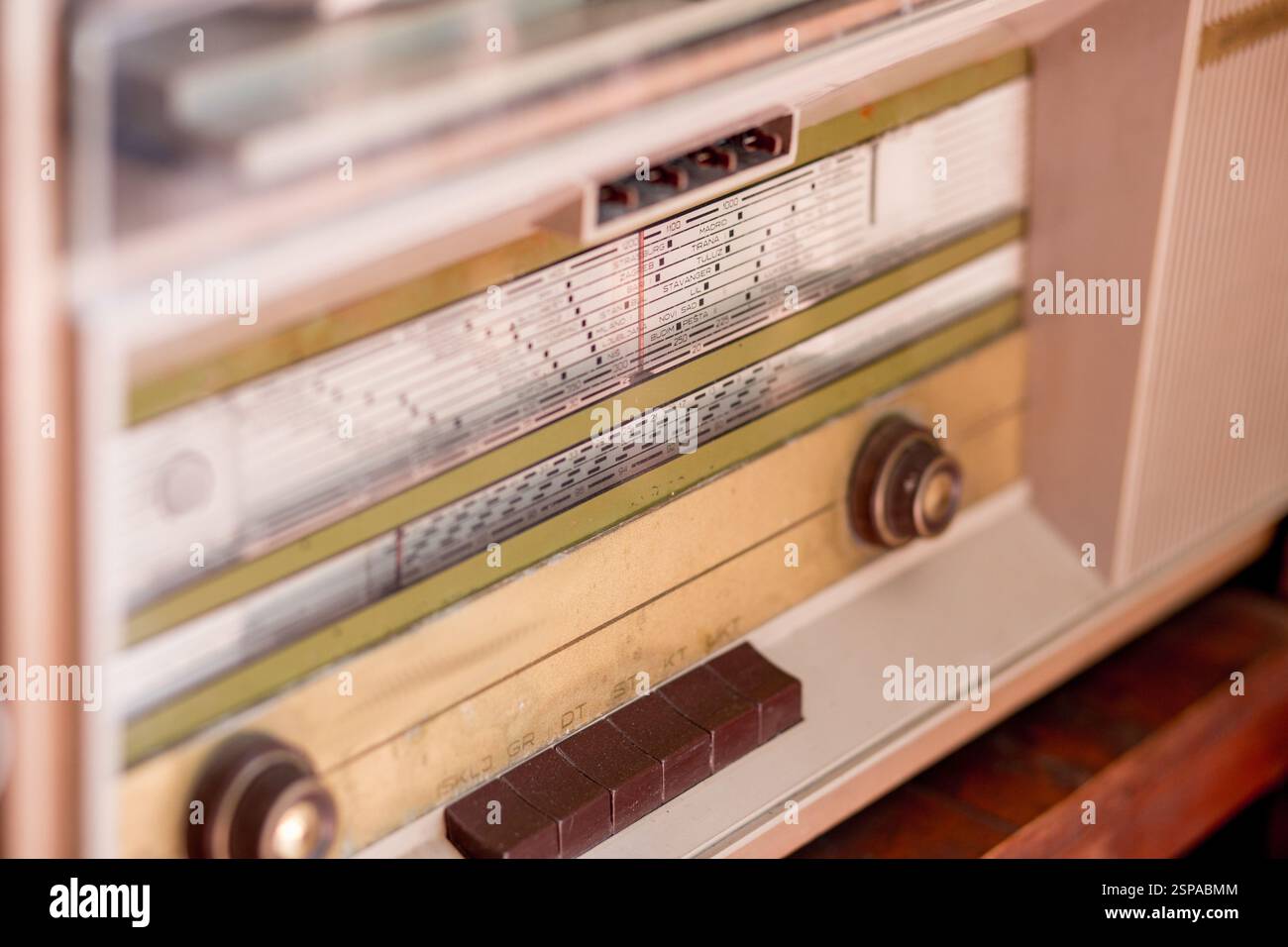 Close-up of a vintage radio with a horizontal tuning scale displaying ...