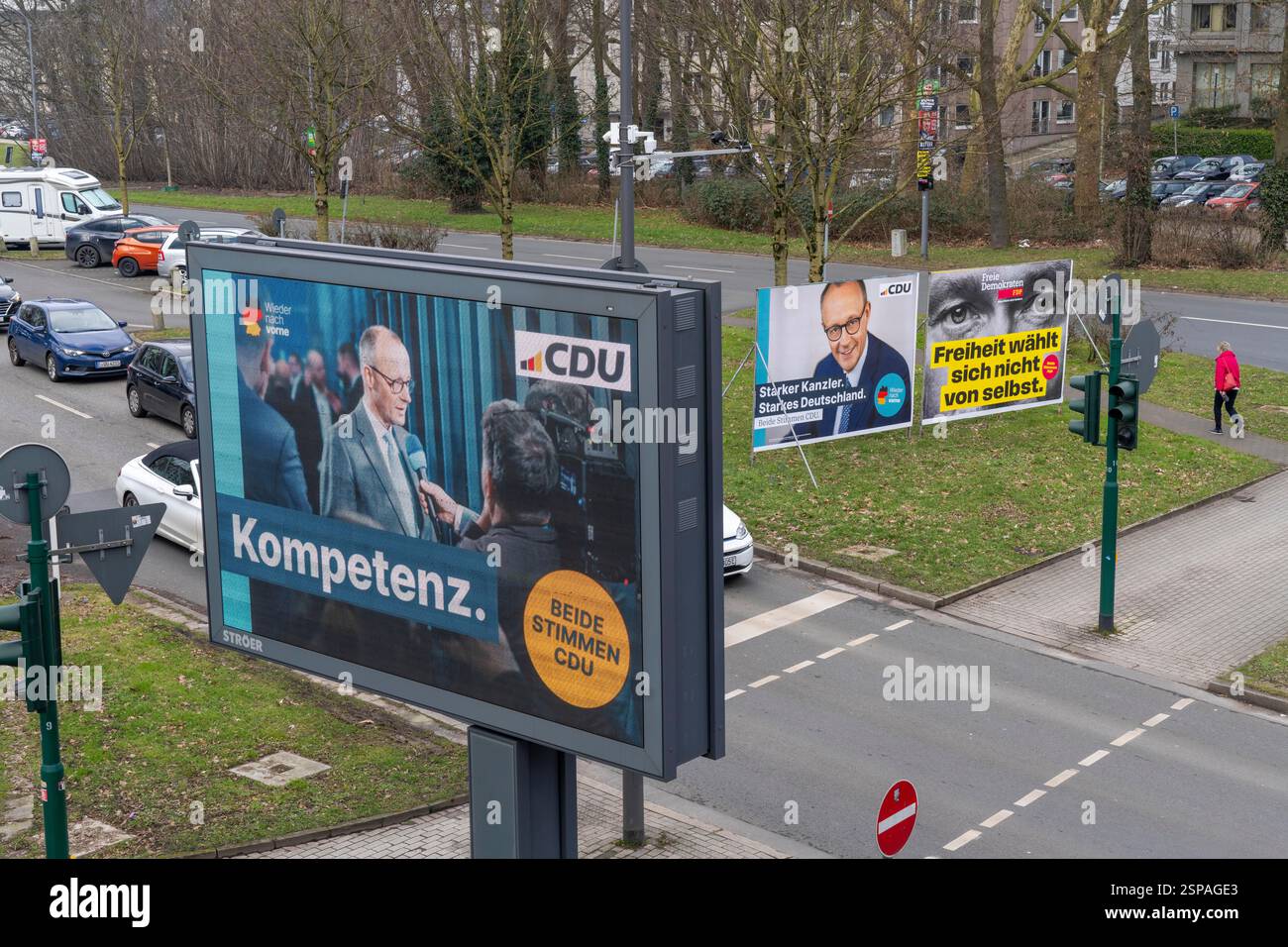 Digital billboard with CDU election advertising, behind it analogue, printed large-scale ...