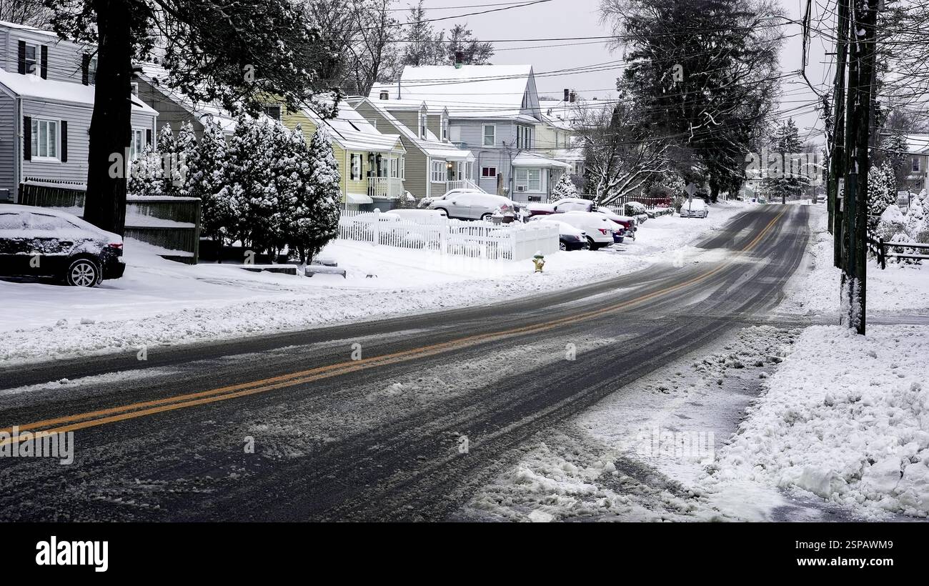NORWALK, CT, USA - FEBRUARY 9, 2025: A snow covered road stretches ...