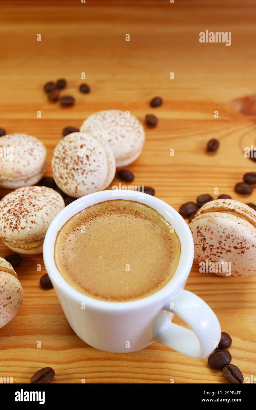 A Cup of Frothy Hot Espresso Coffee with Heap of Tiramisu Macarons ...