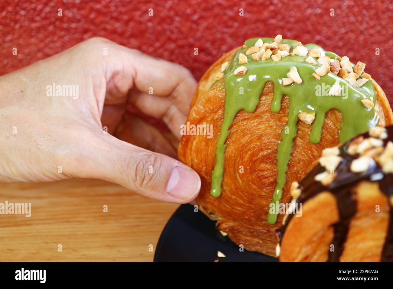 Hand Holding a Delectable Supreme Croissant with Pistachio Ganache and ...