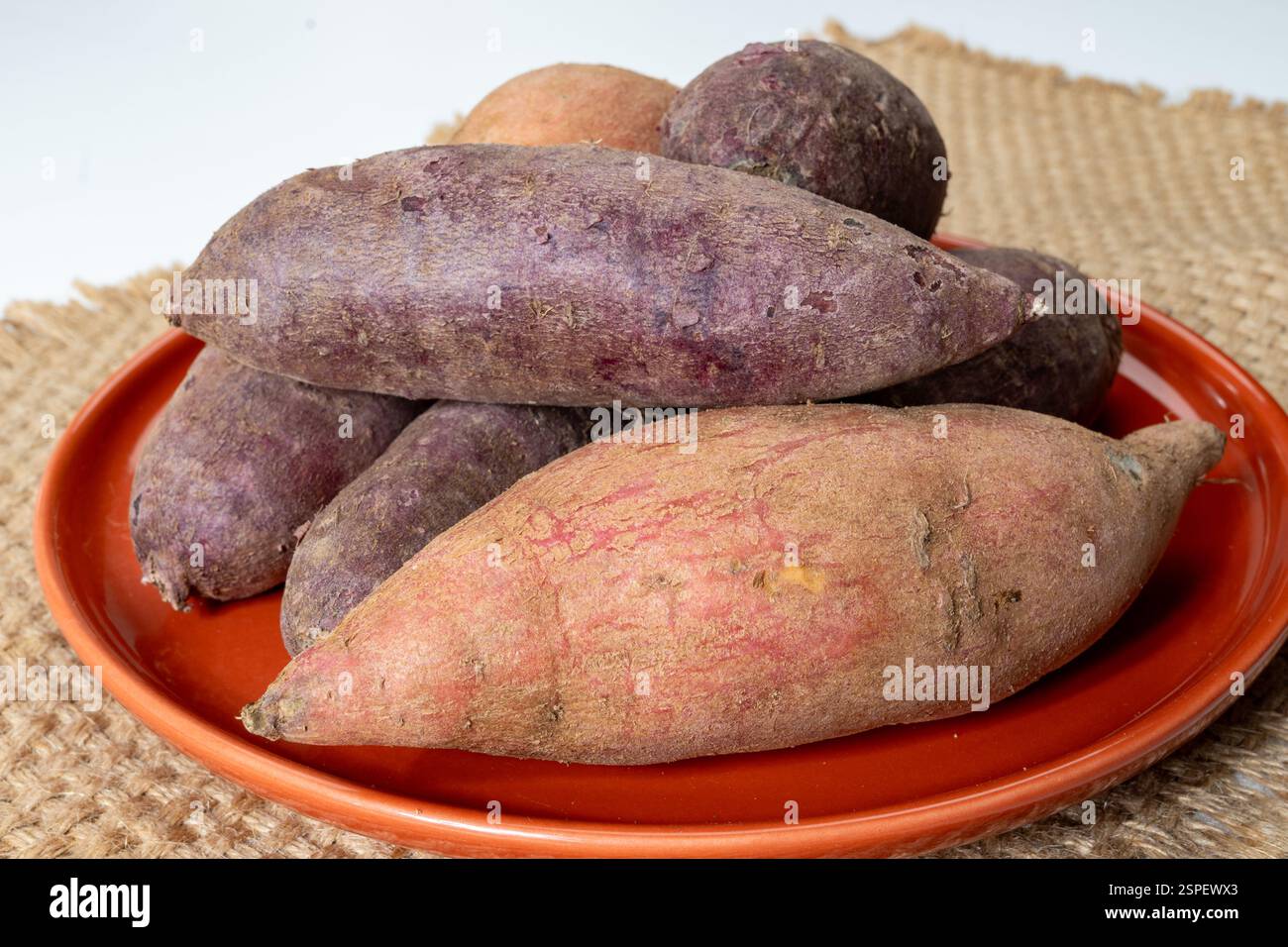 Colorful sweet-tasting tuberous roots vegetables purple and orange ...