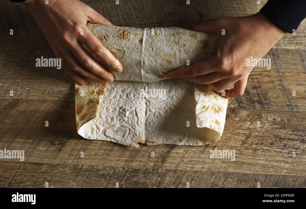 Hand wrapping traditional shawarma beef hi-res stock photography and ...