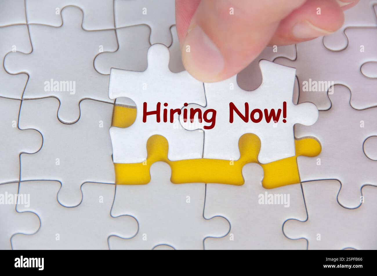 Hand holding jigsaw puzzle with Hiring Now text. Recruitment and Hiring ...