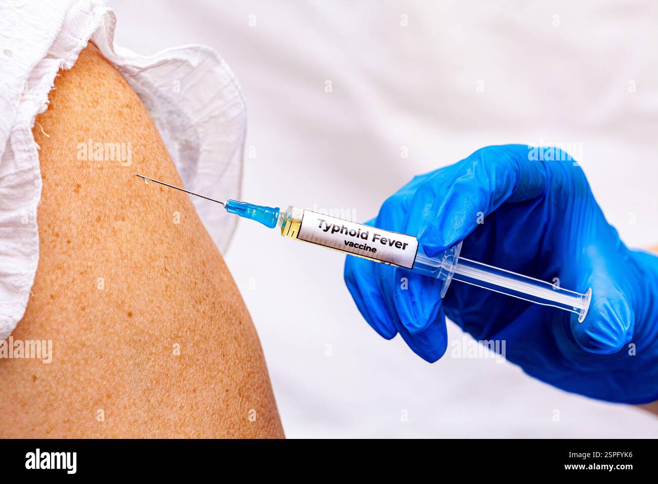 Hand of young woman nurse, doctor giving syringe vaccine, inject shot ...