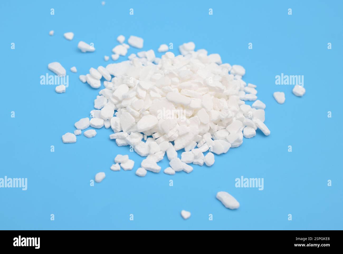 Calcium chloride on blue background Stock Photo - Alamy