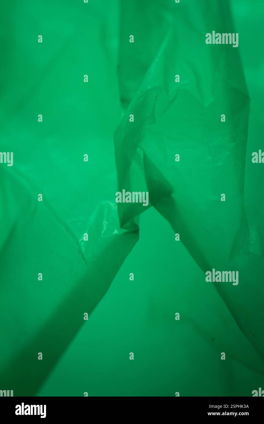 Extreme close up of green empty plastic bag background. The plastic ...