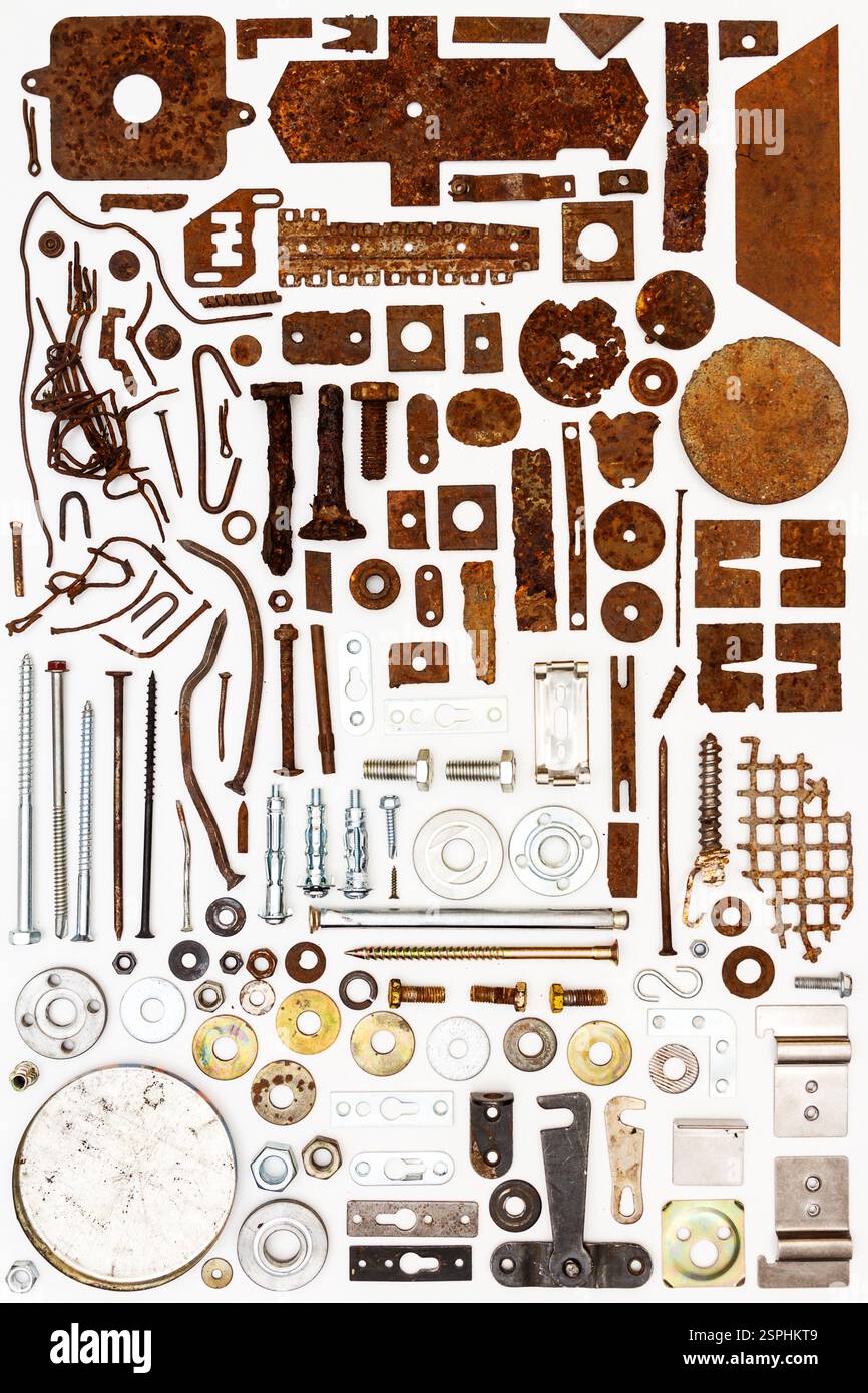 A group of various old and new parts arranged on white. Old rusty nuts ...