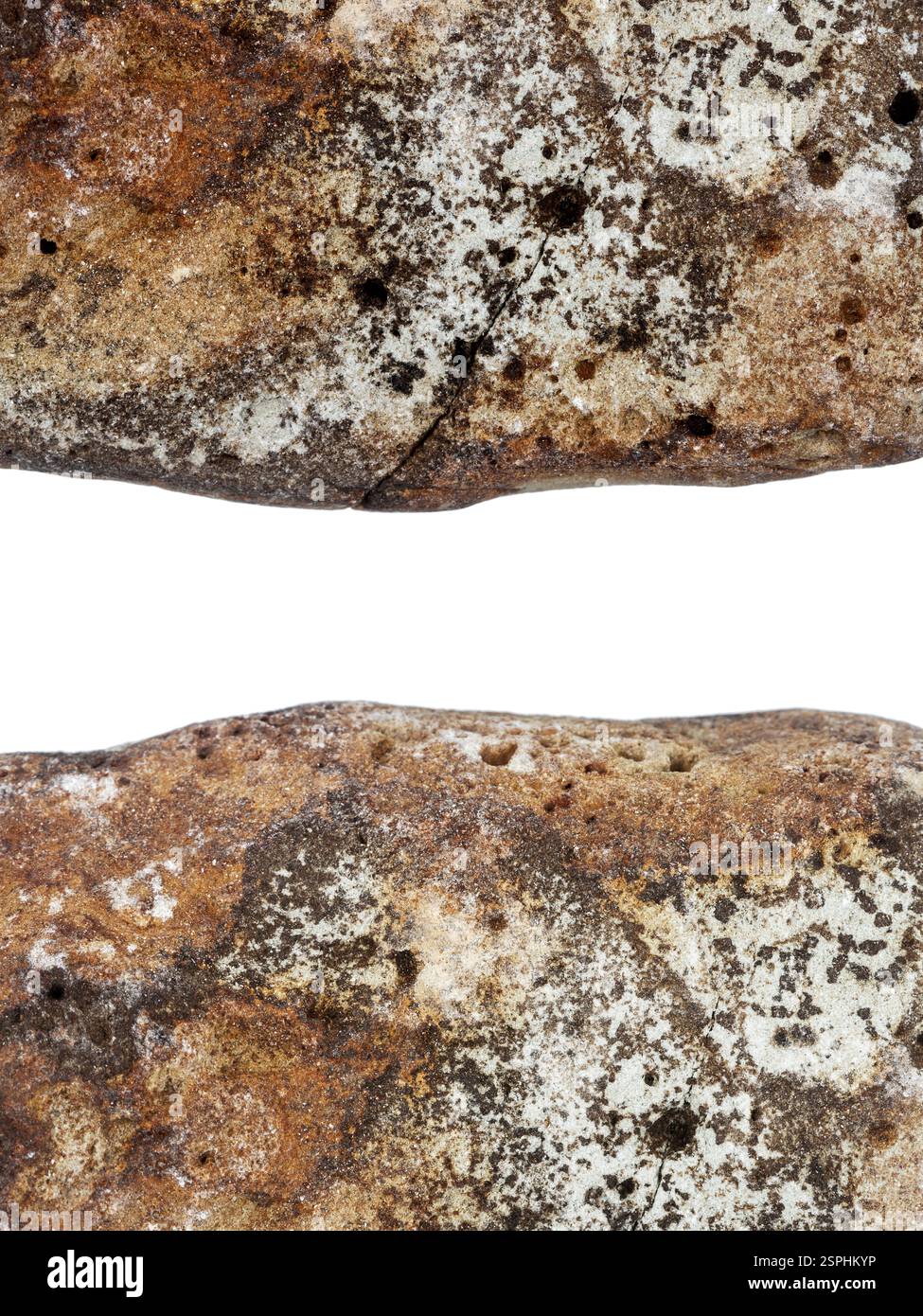 Edges of two pebbles isolated on white background with a space for text ...