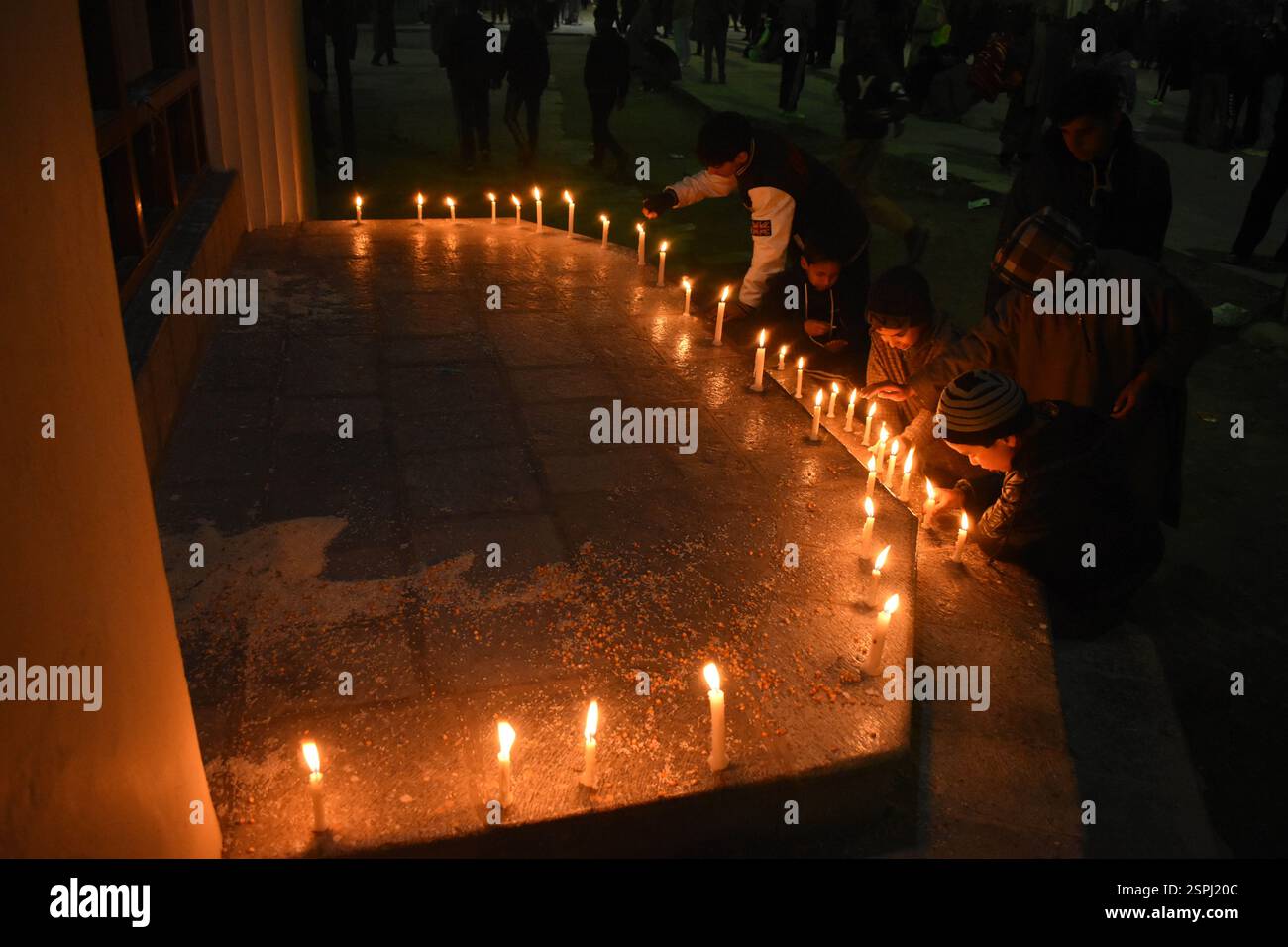 Srinagar, India. 13th Feb, 2025. Muslim children light candles to mark ...