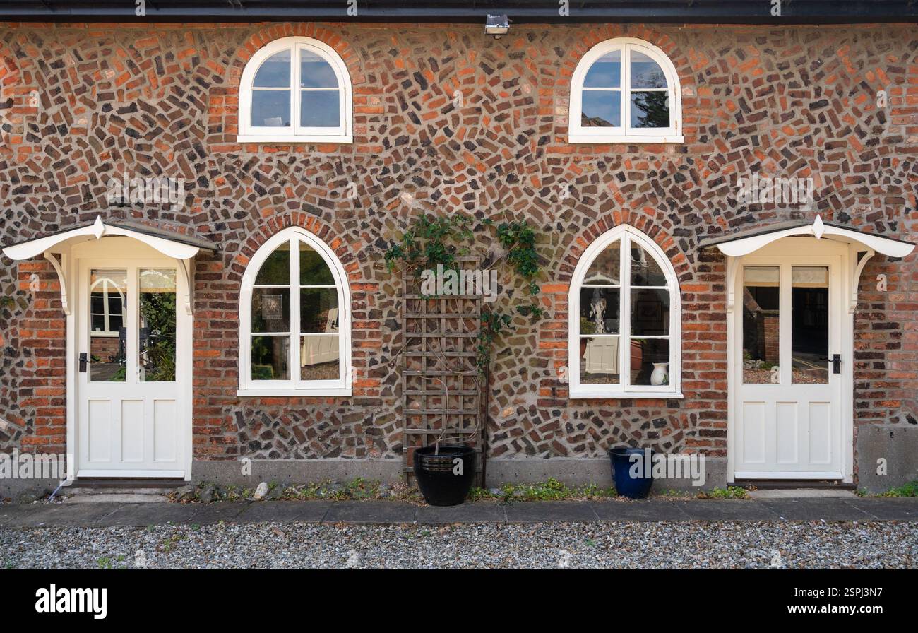 House terrace with old brick walls with arched windows and canopied ...
