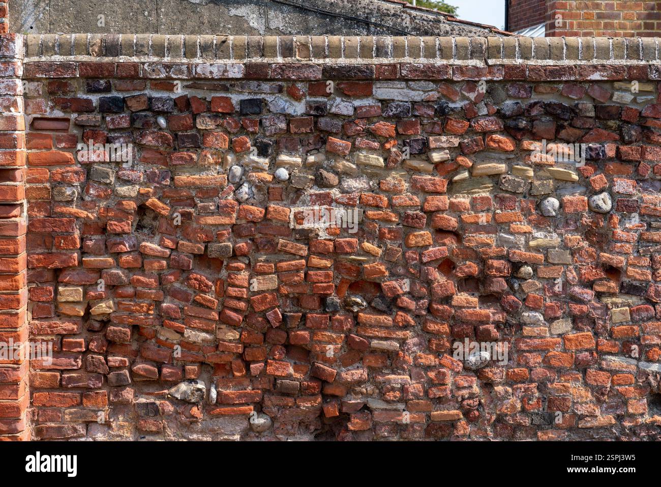 Old flint walls with windows taken in daylight around Wells-next-the ...