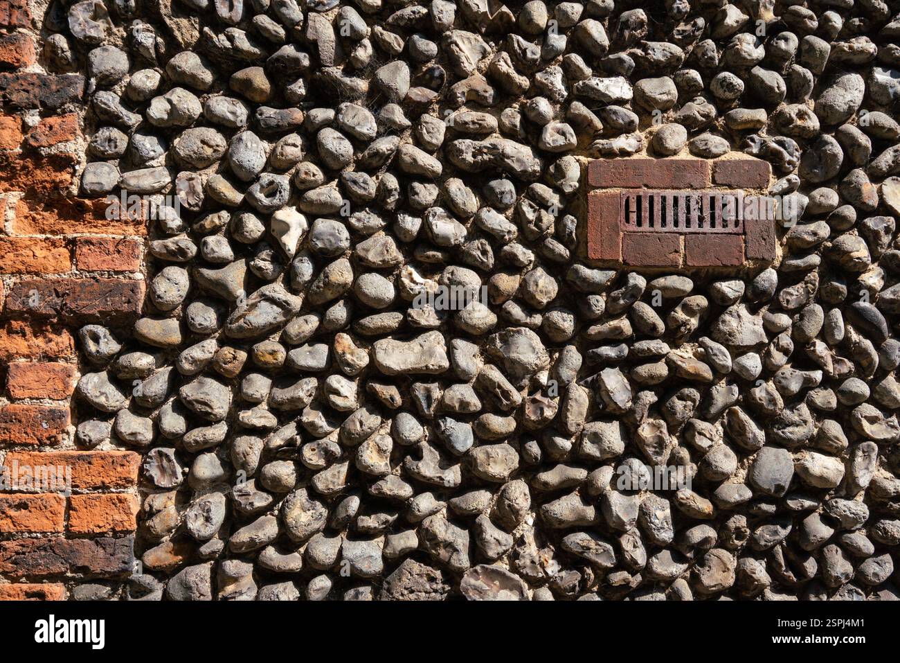 Old flint walls with windows taken in daylight around Wells-next-the ...