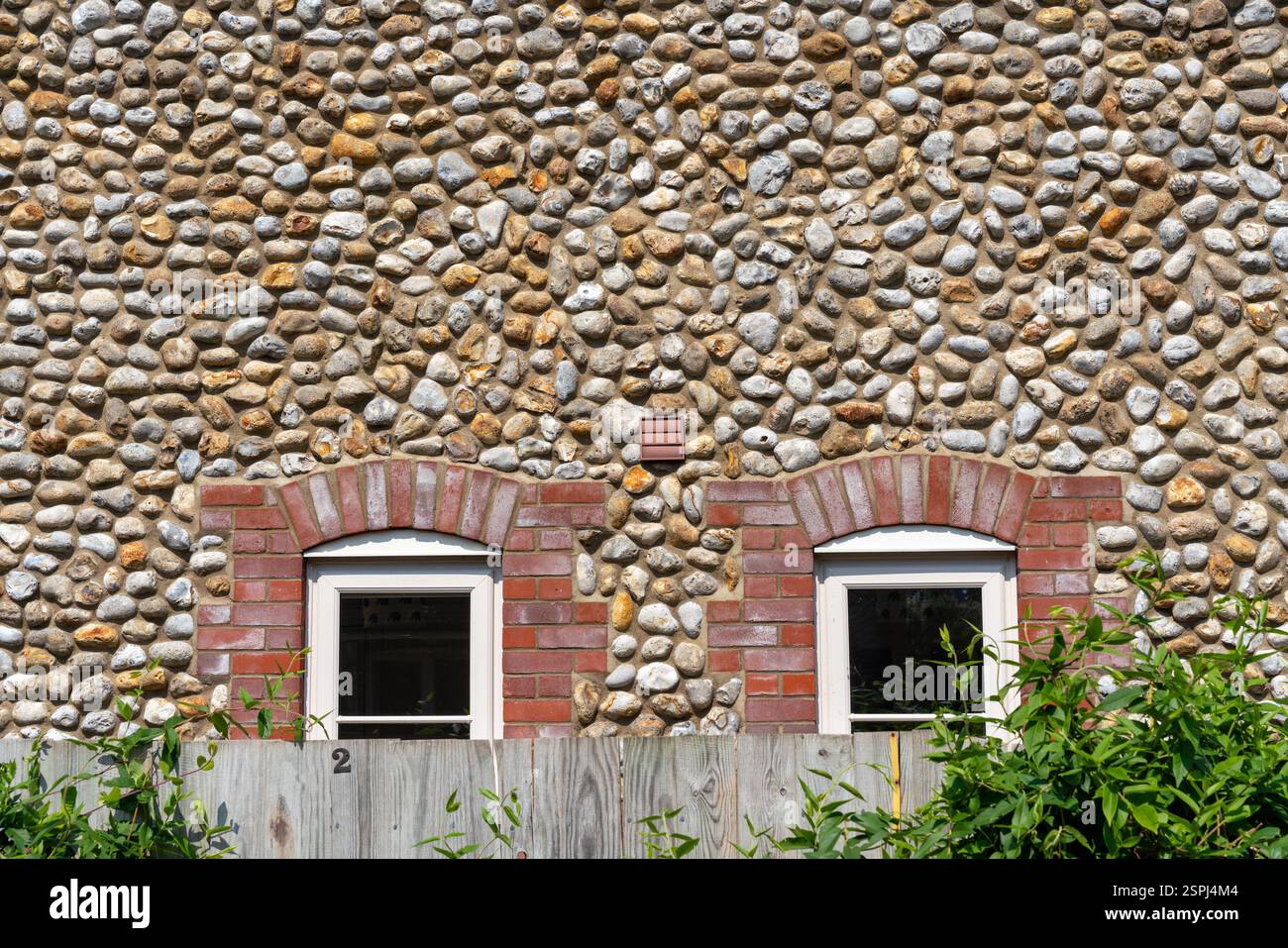 Old flint walls with windows taken in daylight around Wells-next-the ...