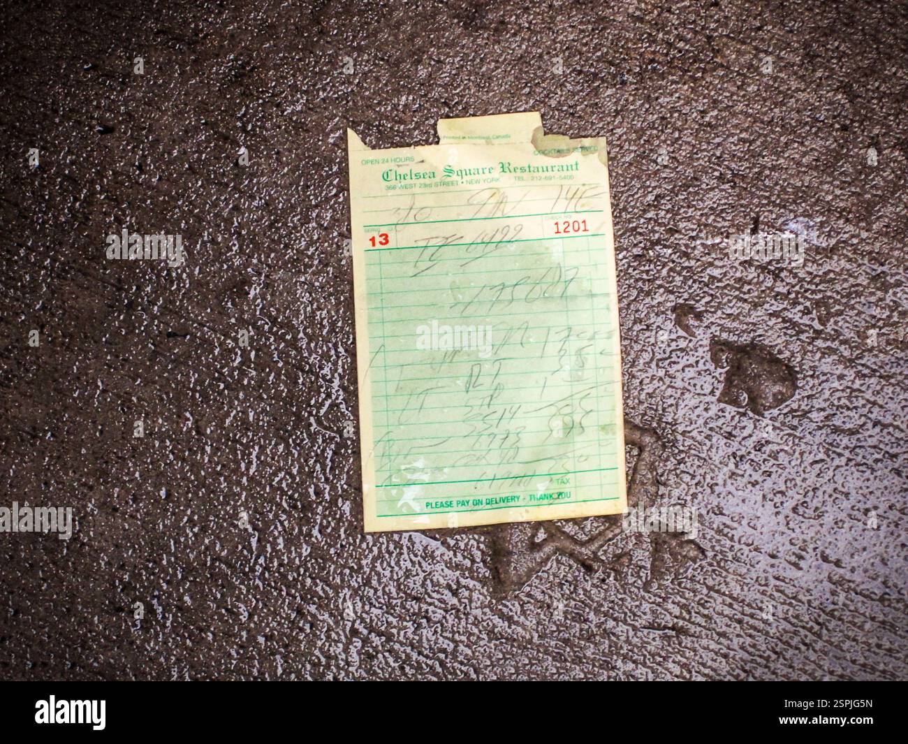 A discarded receipt from a delivery from the Chelsea Square Restaurant ...