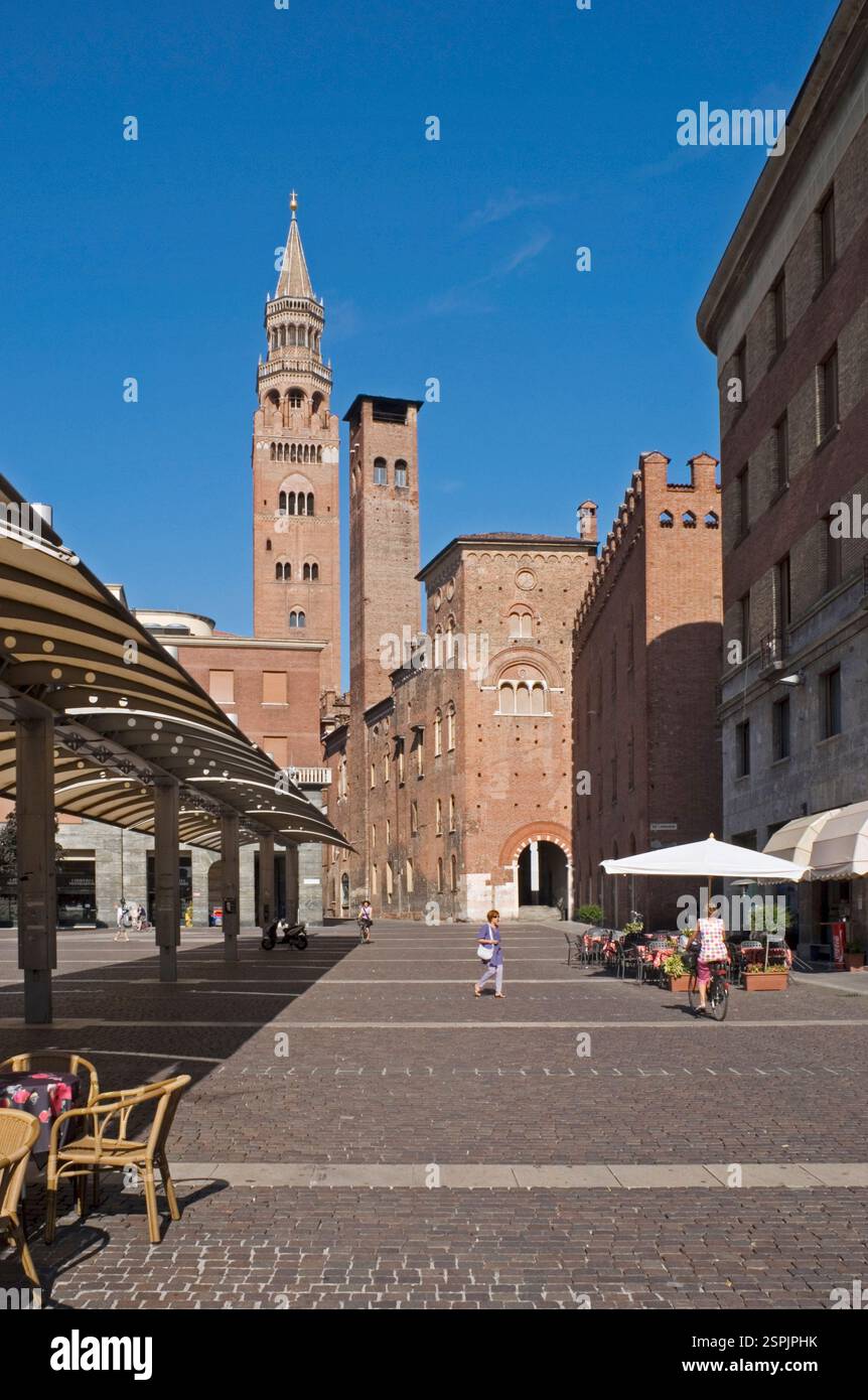 Piazza Stradivari, cobblestone square with Torrazzo bell tower in the background, Cremona ...