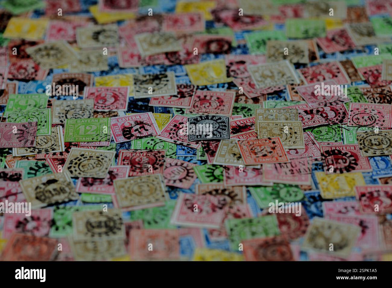 A dense collection of vintage postage stamps in various colors and ...