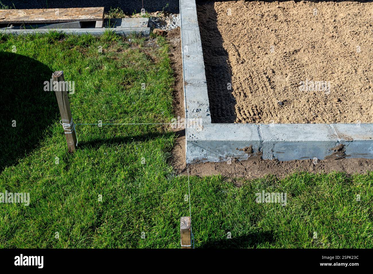 Sand bed prepared for compaction for construction of the terrace ...