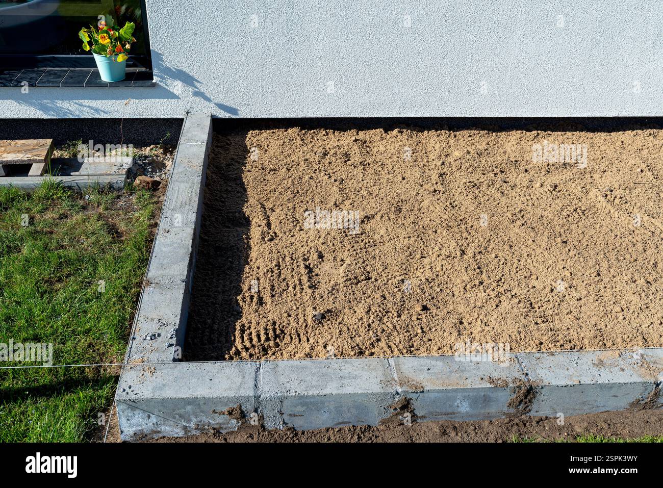 Sand bed prepared for compaction for construction of the terrace ...