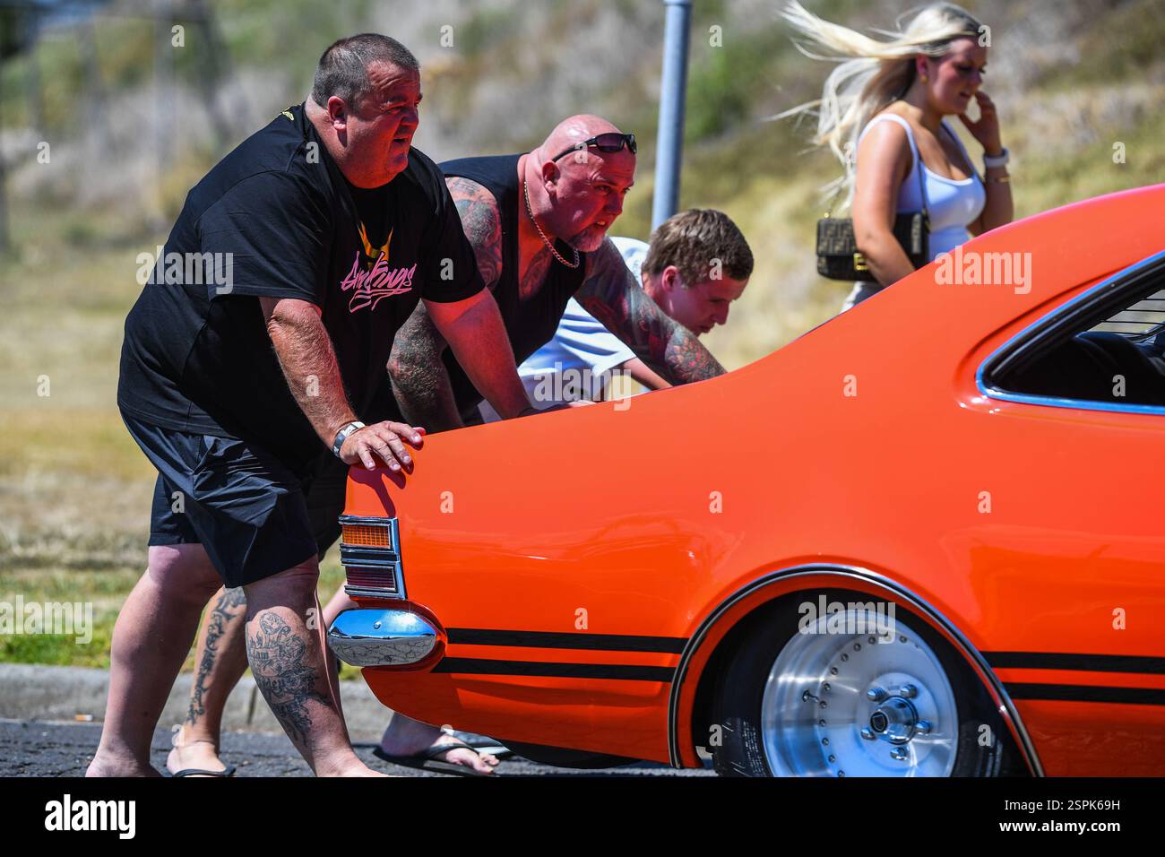 Group of men are seen pushing a classic Holden Monaro during the Tuff ...