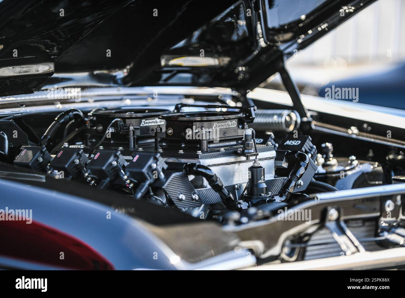 Engine works with big V8 under the hood of a show car is seen during ...