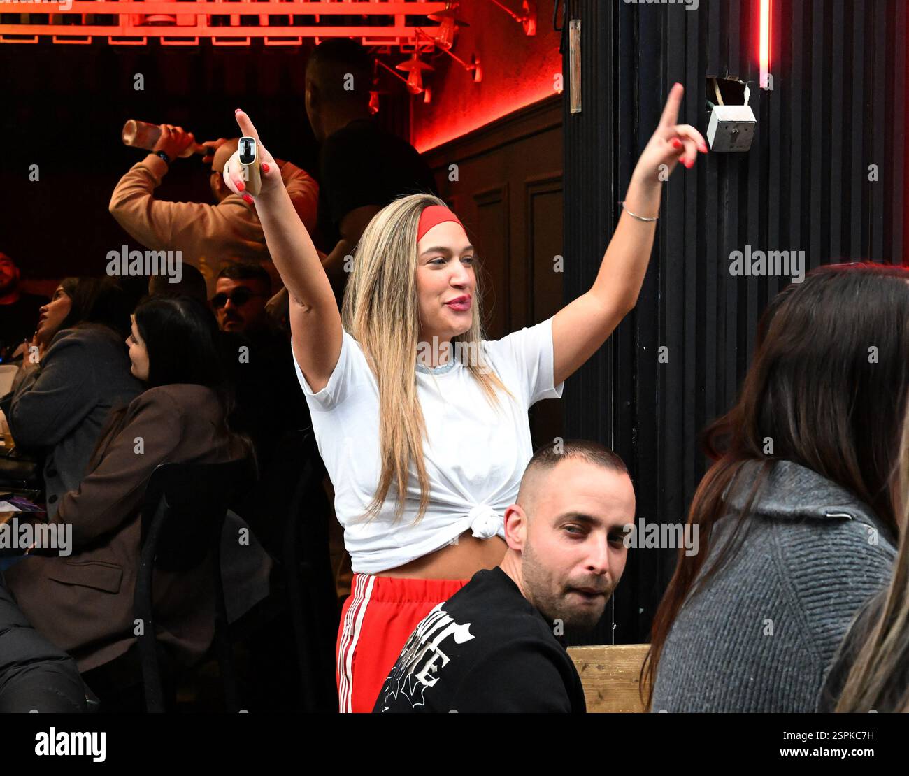 Jerusalem, Israel. 14th Feb, 2025. An Israeli woman dances in a bar on ...