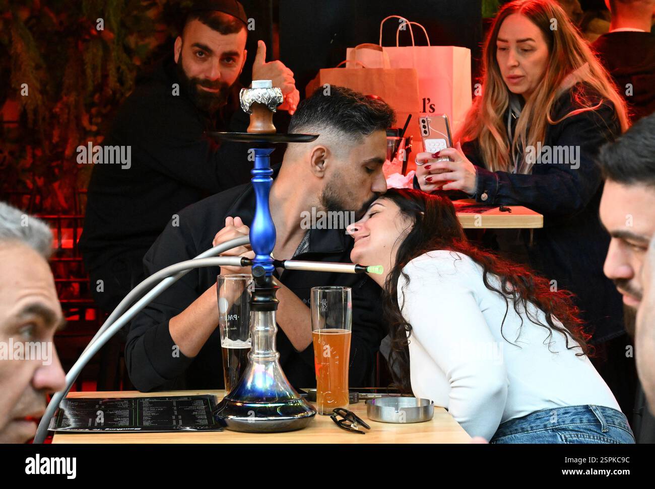 Jerusalem, Israel. 14th Feb, 2025. An Israeli man kisses his girlfriend ...
