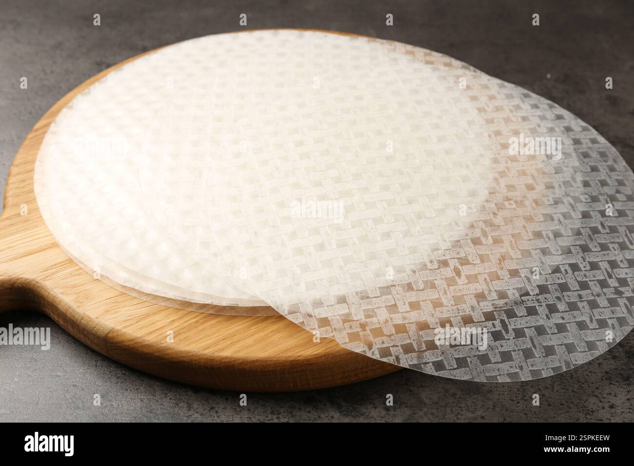 Edible rice paper sheets on grey textured table, closeup Stock Photo ...