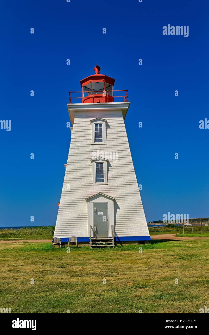 A vertical landscape image of the vintage lighthouse at Cape Egmont on ...