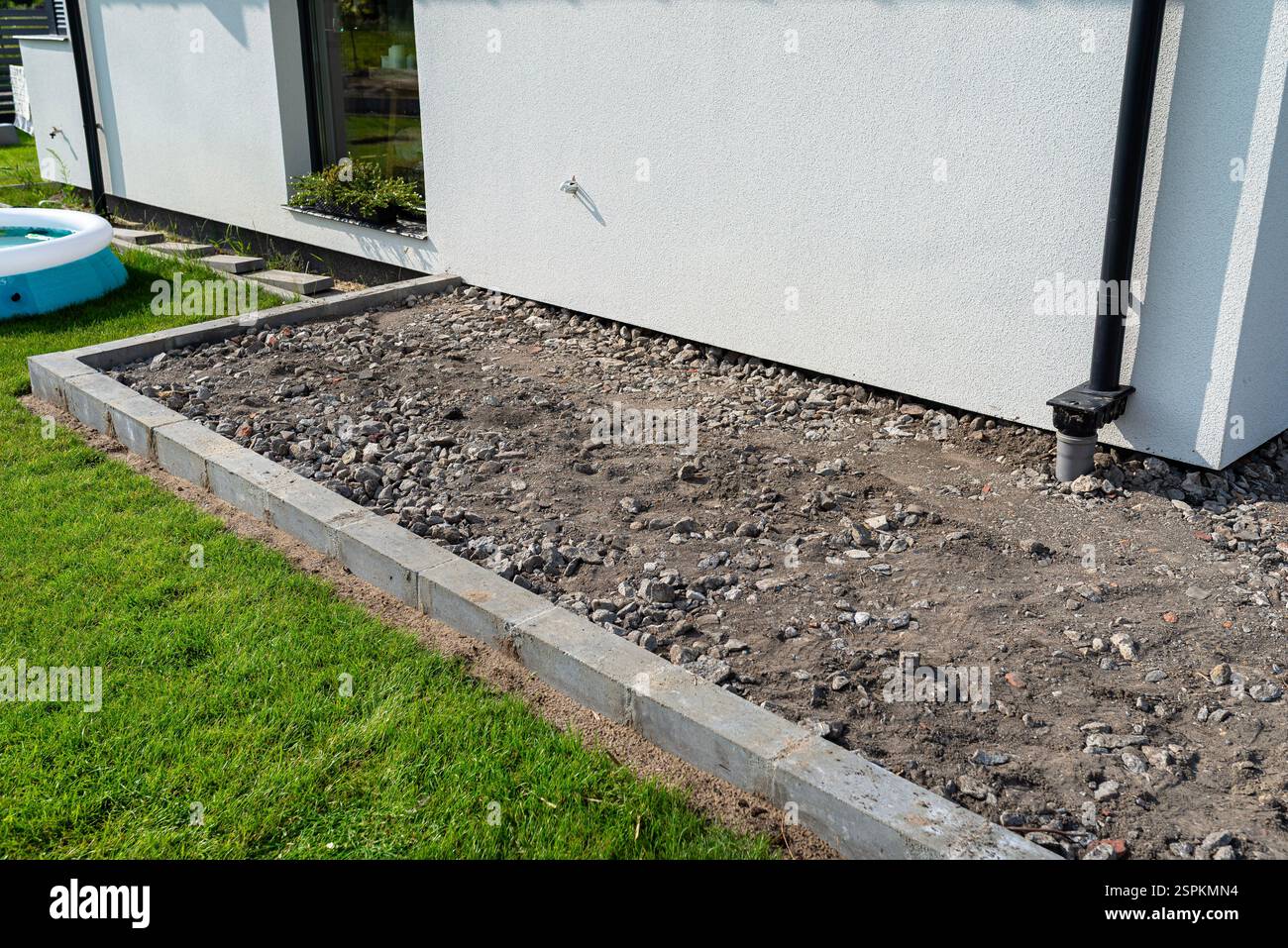 Compacting rubble on a terrace under construction using a gasoline ...
